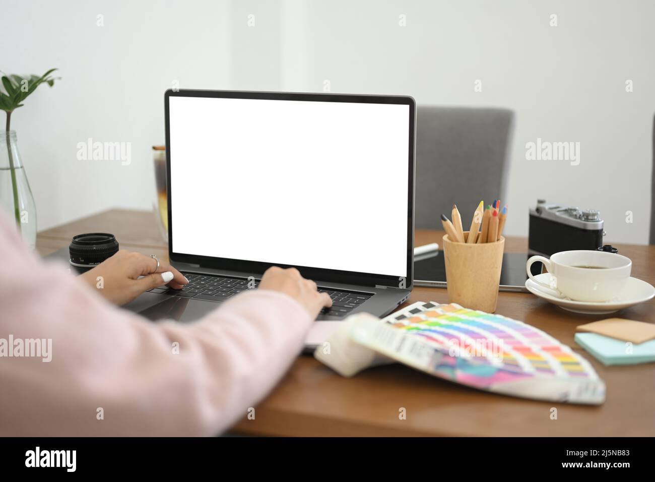 Cropped, close-up, Female graphic designer working on laptop computer ...