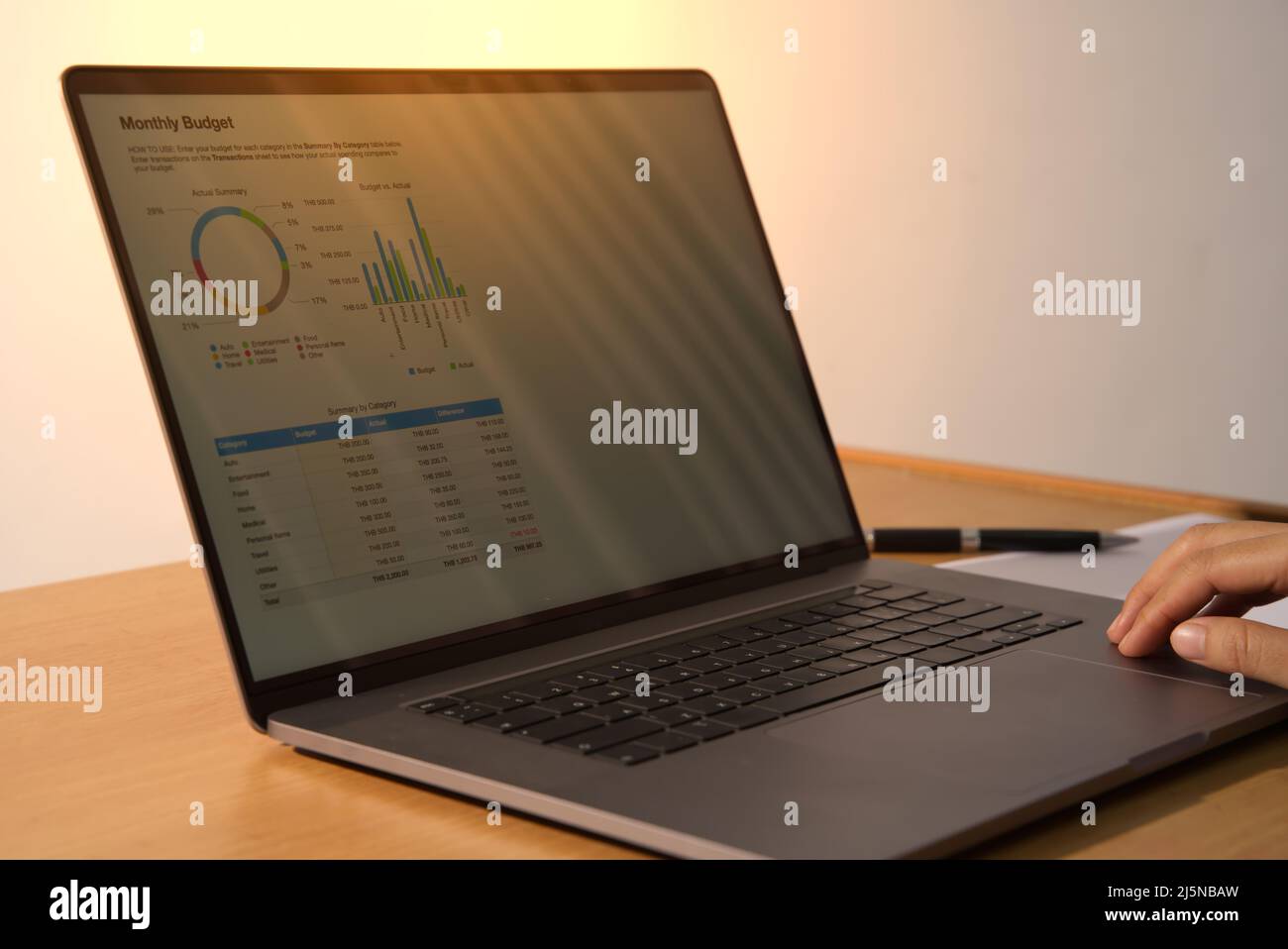 Business people use notebook programs in their offices to plan reports ...