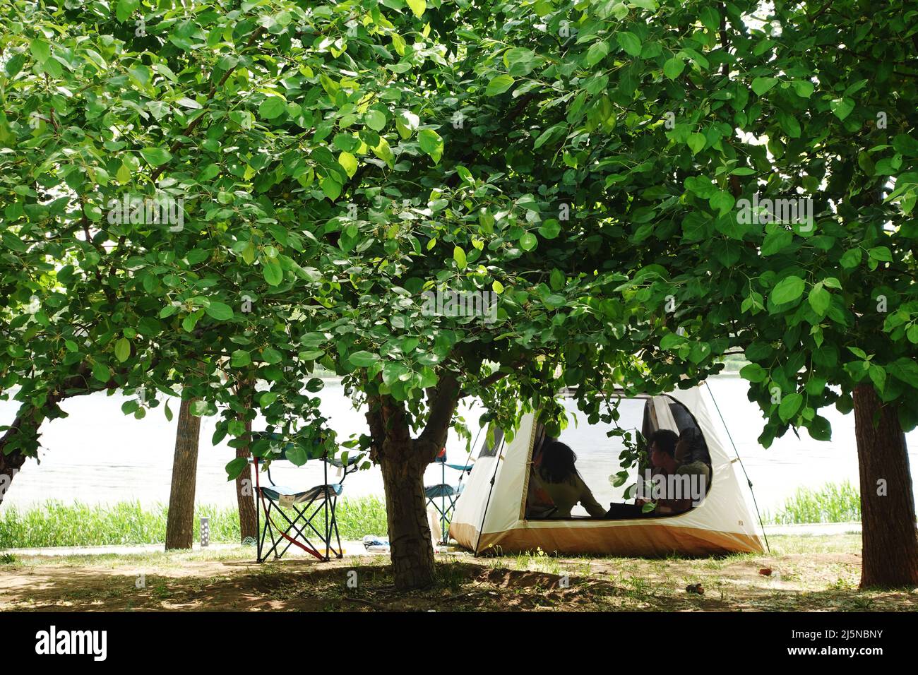 Chinese families camp outdoors to enjoy the weekends Stock Photo - Alamy