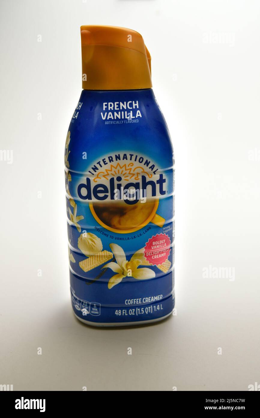 Cut out Flavored coffee creamer in plastic bottle isolated on white ...