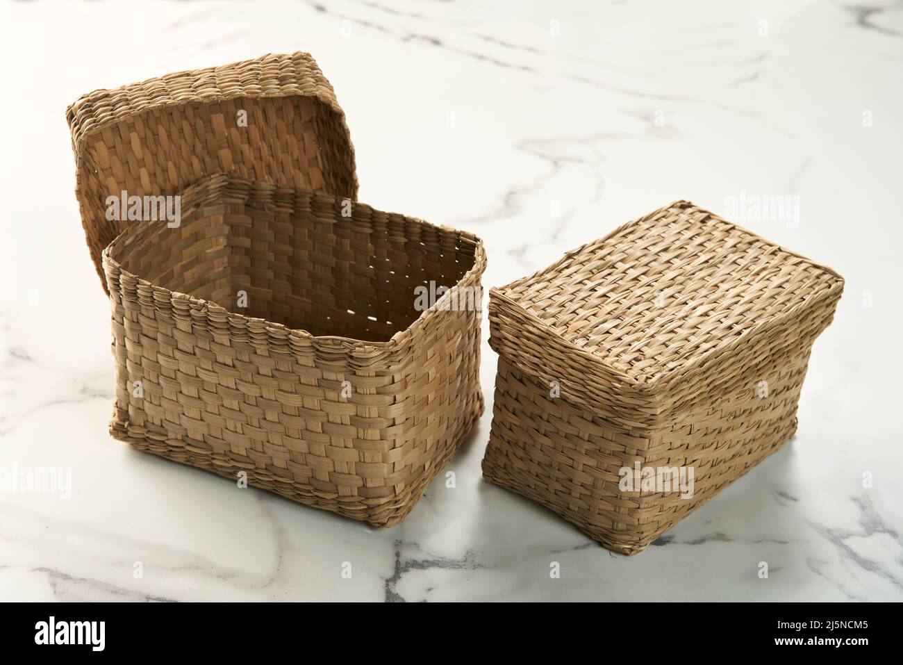 Two closed and open handmade craft boxes, made of water hyacinth Stock ...