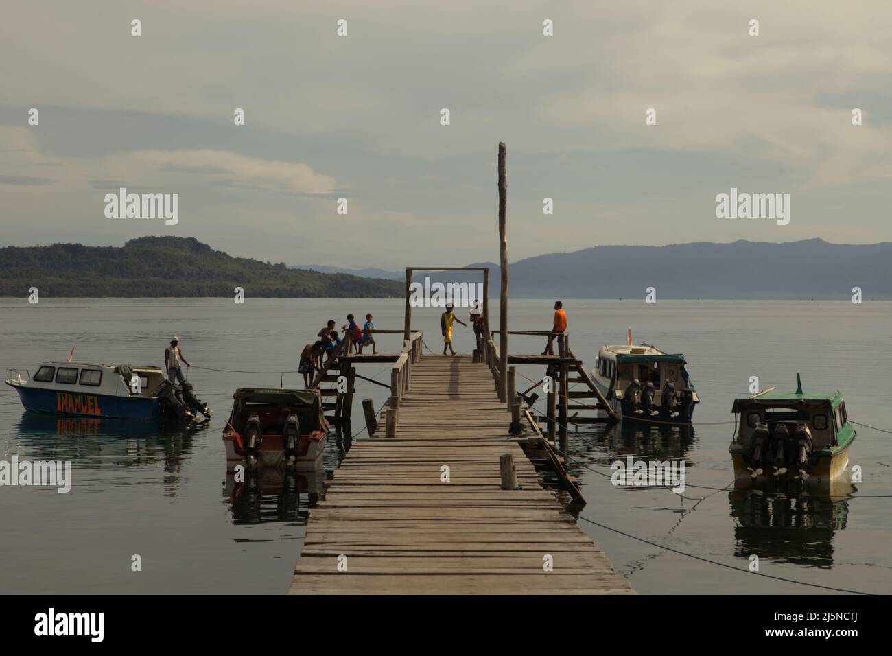 A pier for chartered boats in the town of Tulehu in Ambon Island ...