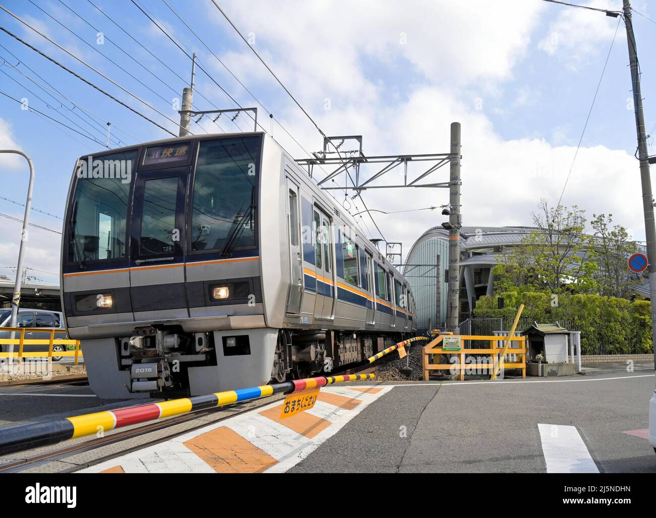 A train passes near the site of the 2005 fatal train derailment in the western Japan city of ...