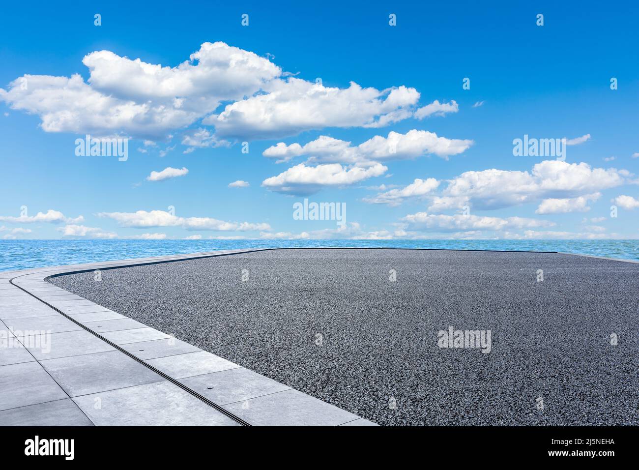 Empty asphalt road platform and lake under blue sky Stock Photo - Alamy