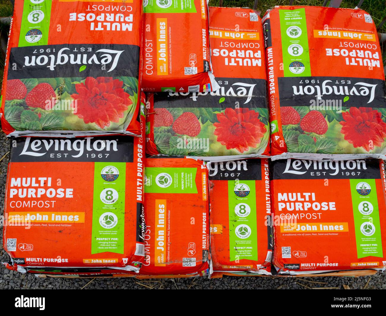 A stack of bags of Levington multi purpose Compost in a garden centre ...