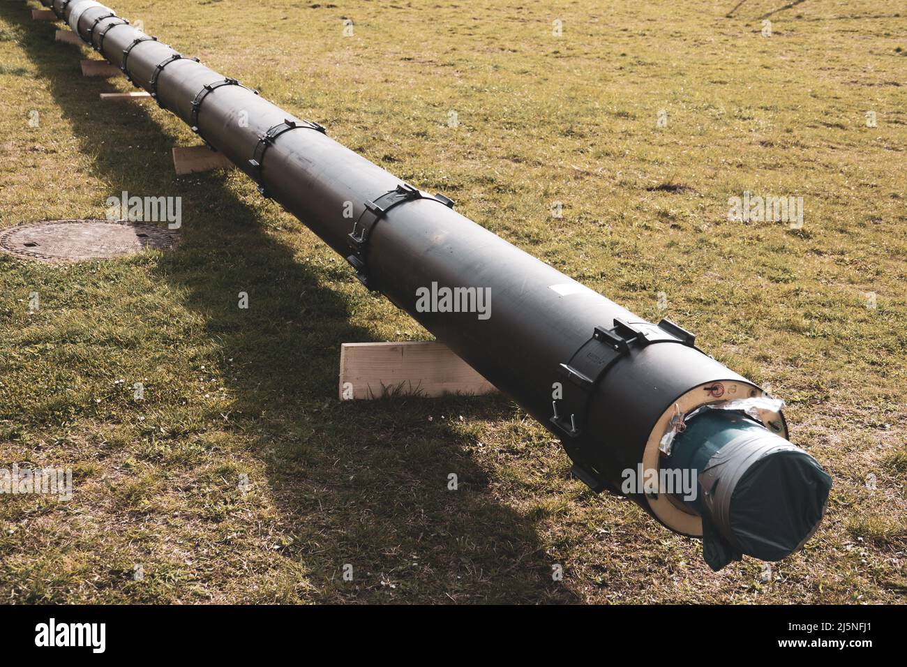 a long gas pipeline lies ready for laying Stock Photo - Alamy