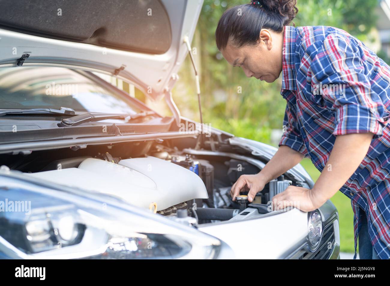 Open hood mechanic engine system to check and repair damage car crash ...
