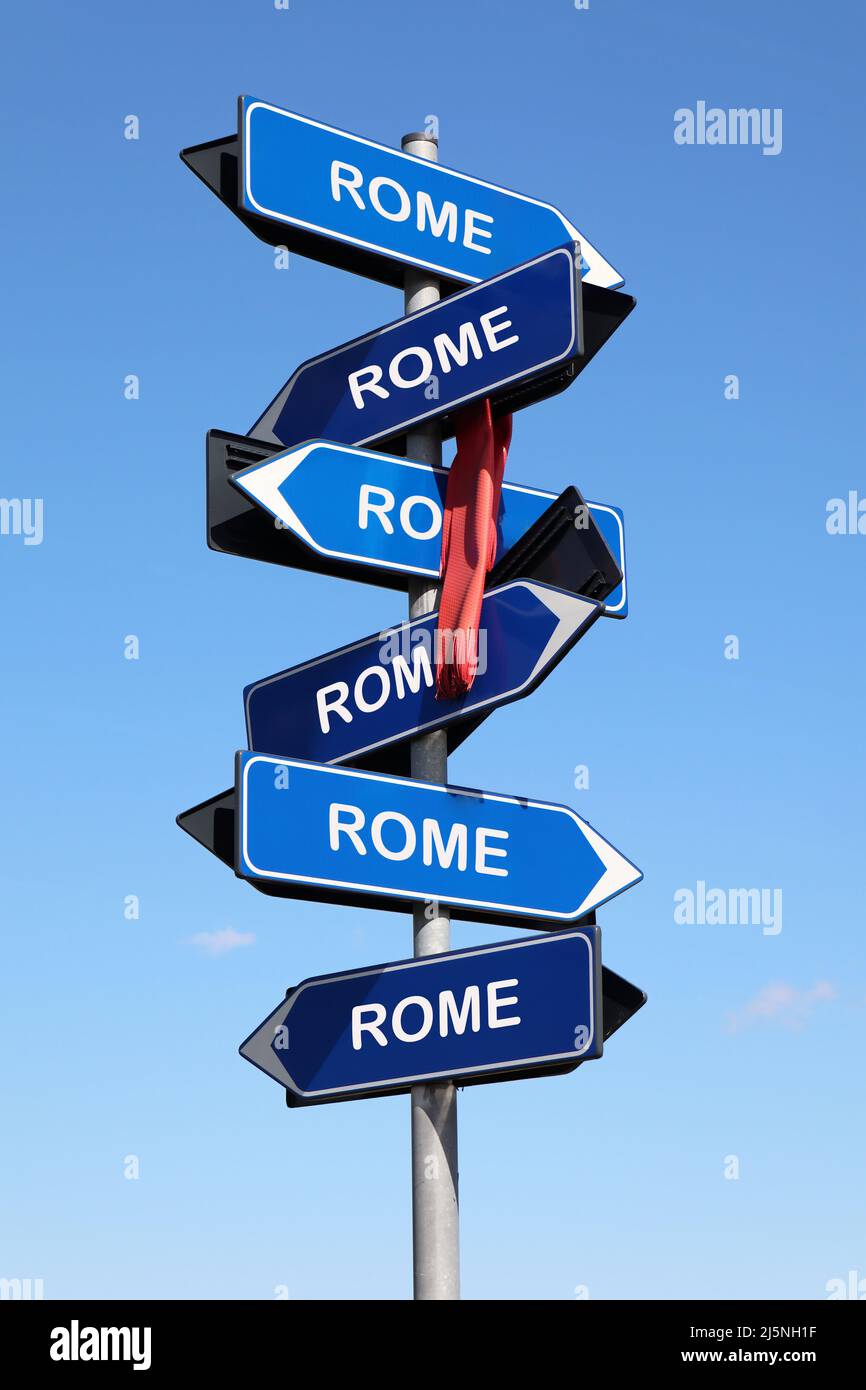 Street sign with Rome city name on blue sky background. All roads lead ...