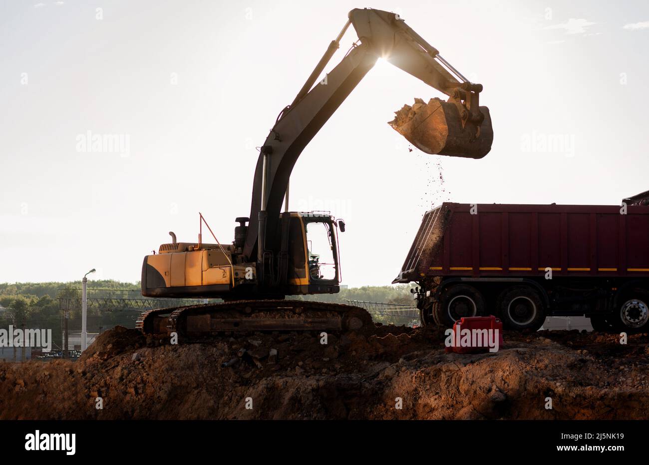 Excavation and loading onto dump trucks with excavators. The work of ...