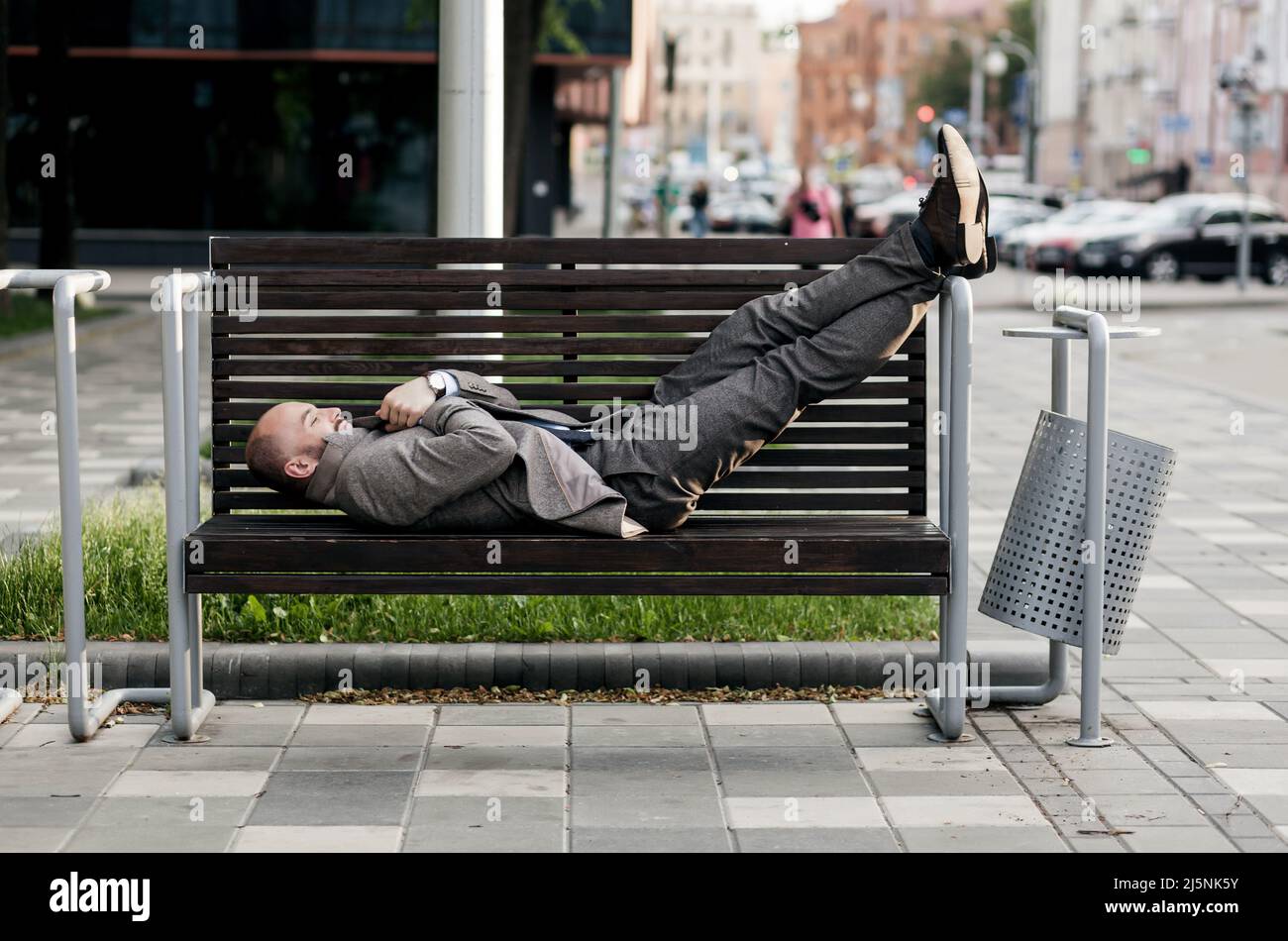 Businessman lying on bench hi-res stock photography and images - Alamy