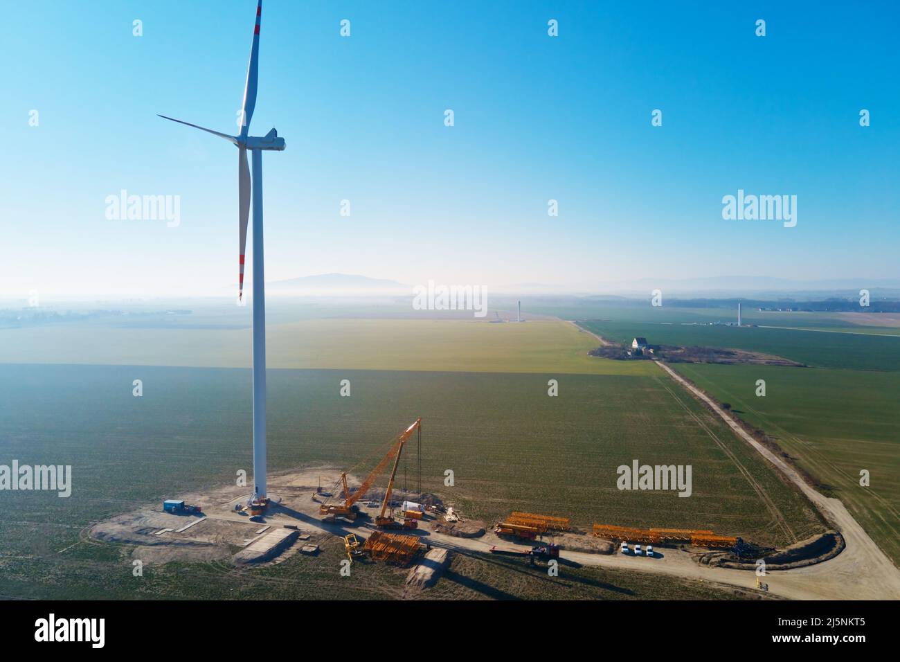 Construction site near windmill turbine, Wind generator installing ...