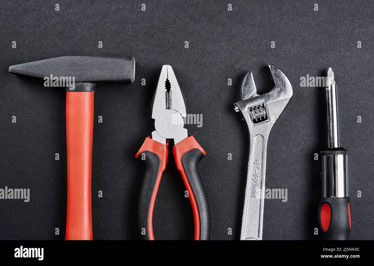 Set of tools for repair and maintenance on black background Stock Photo ...