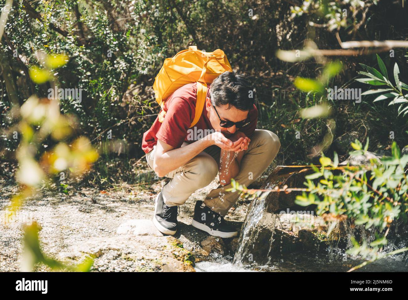 Man drinking water from river hi-res stock photography and images - Alamy