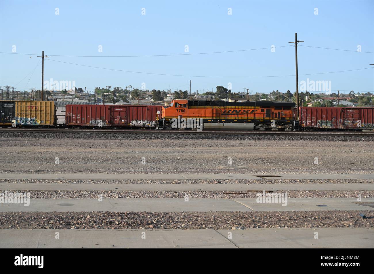 Barstow, California, USA-April 24 2022: BNSF 7780 BNSF Railway GE ES44DC locomotive passing ...