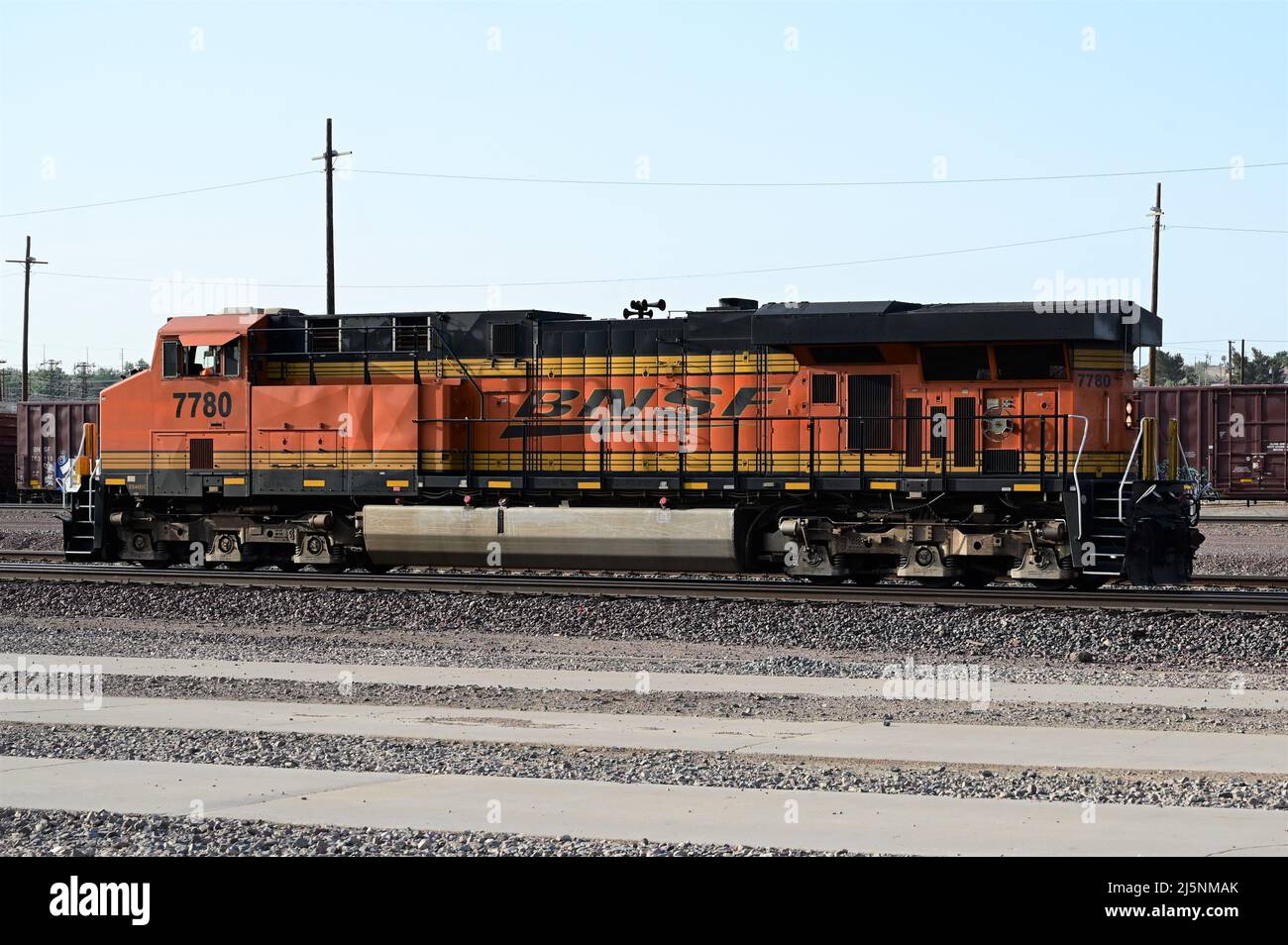 Barstow, California, USA-April 24 2022: BNSF 7780 BNSF Railway GE ES44DC locomotive passing ...