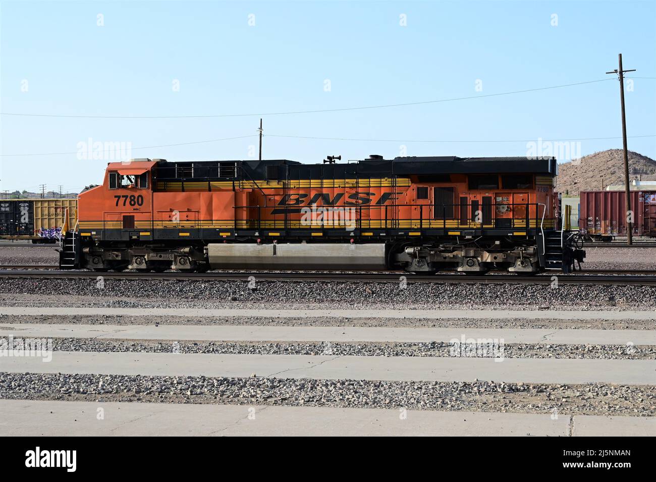 Barstow, California, USA-April 24 2022: BNSF 7780 BNSF Railway GE ES44DC locomotive passing ...