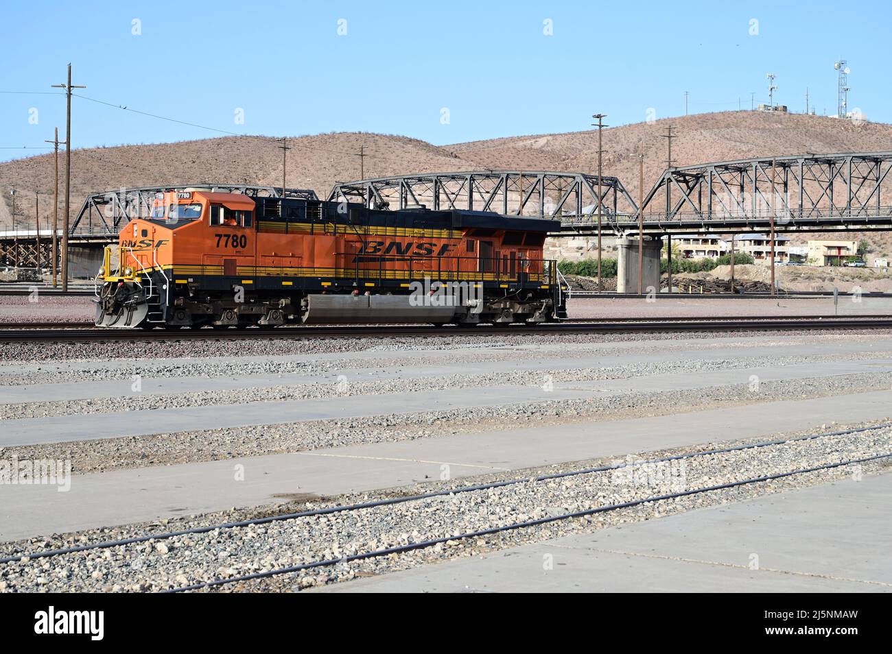Barstow, California, USA-April 24 2022: BNSF 7780 BNSF Railway GE ES44DC locomotive passing ...