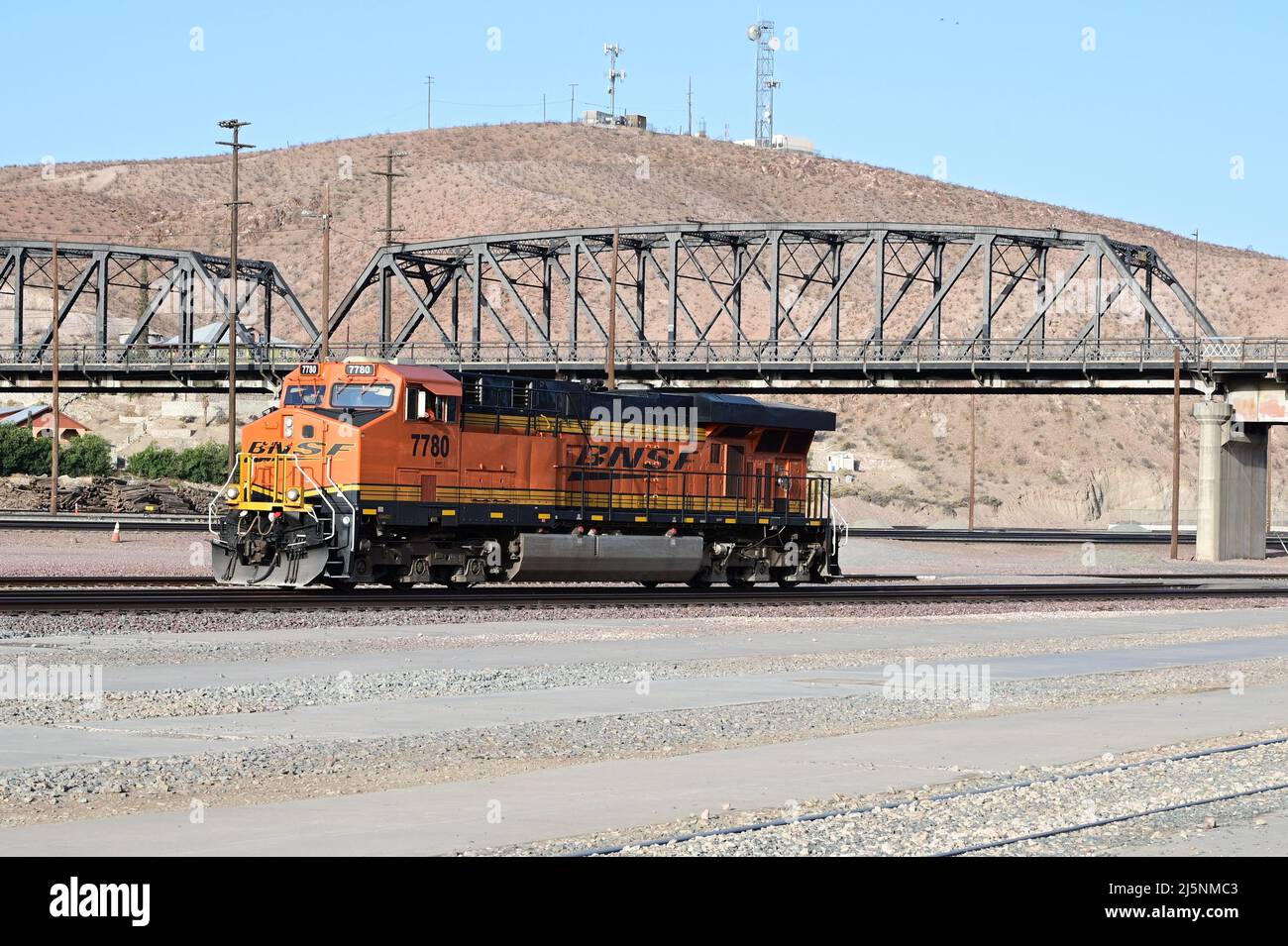 Barstow, California, USA-April 24 2022: BNSF 7780 BNSF Railway GE ES44DC locomotive passing ...
