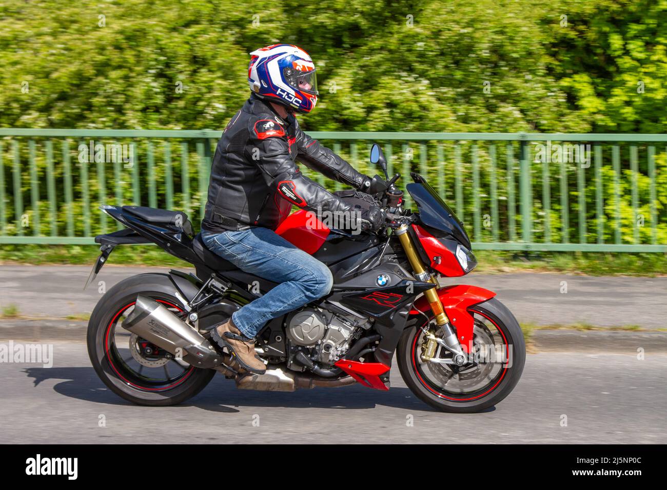 2018 red BMW S 1000 999cc petrol motorcycle; Motorbike rider; two ...