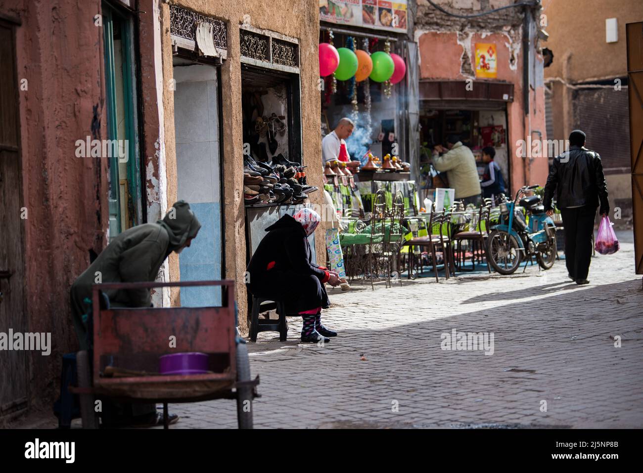 Marrakesh, Morocco-February 28,2020:A typical street in the ancient ...