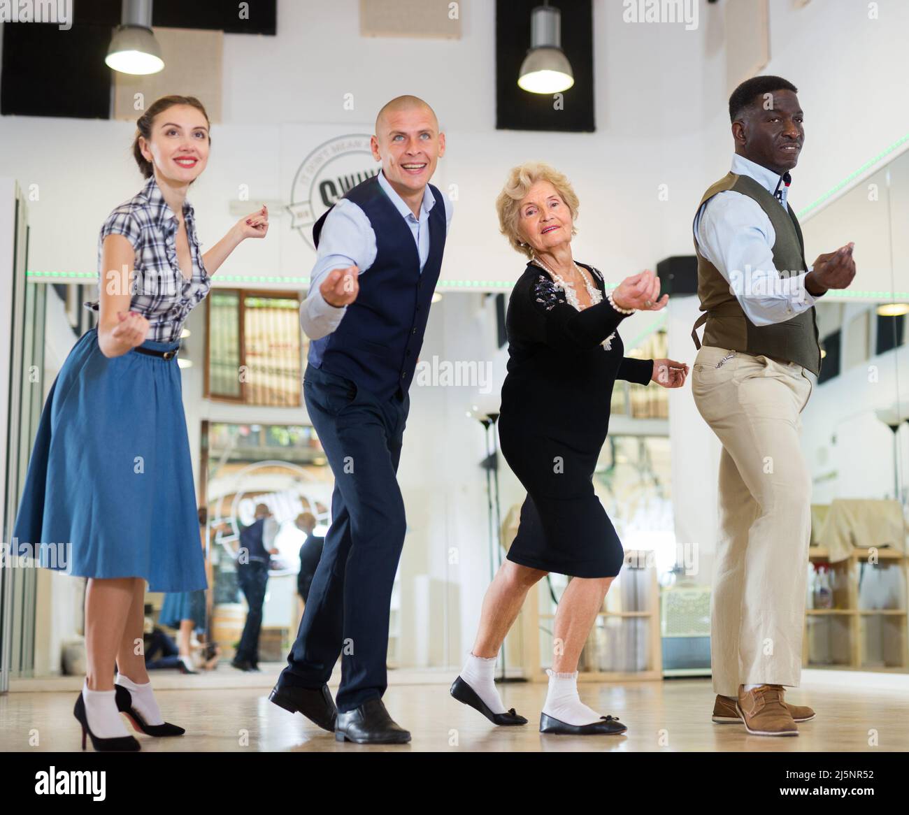Group of different age dancers preparing swing performance Stock Photo ...