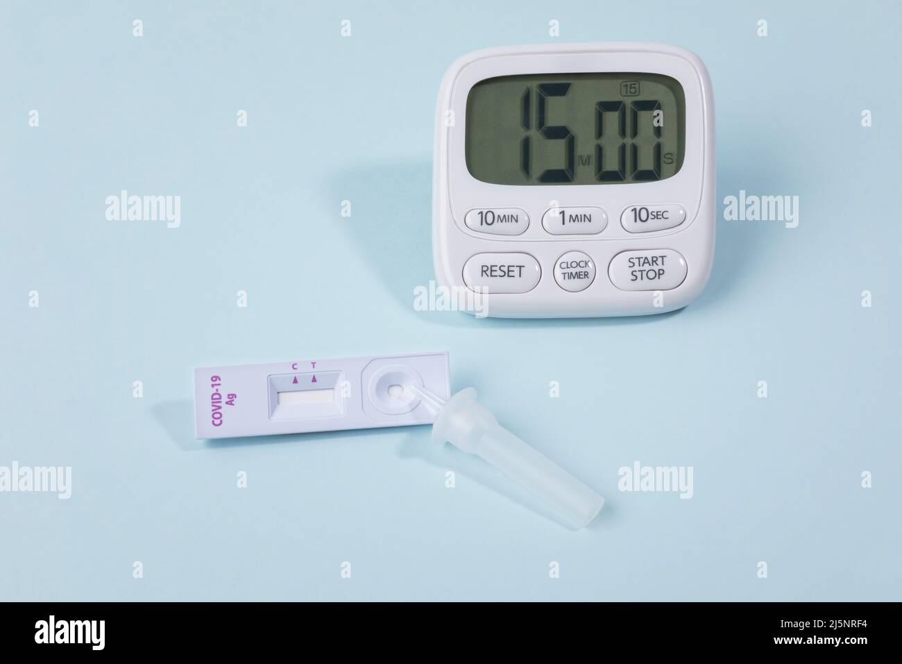 timer and self covid test kit Stock Photo - Alamy
