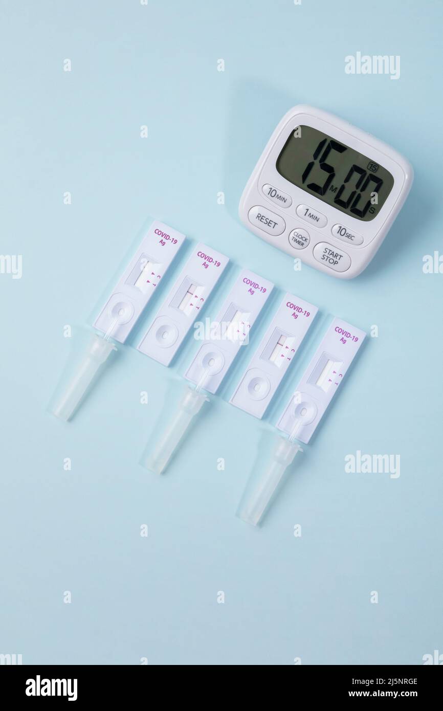 timer and self covid test kits Stock Photo - Alamy