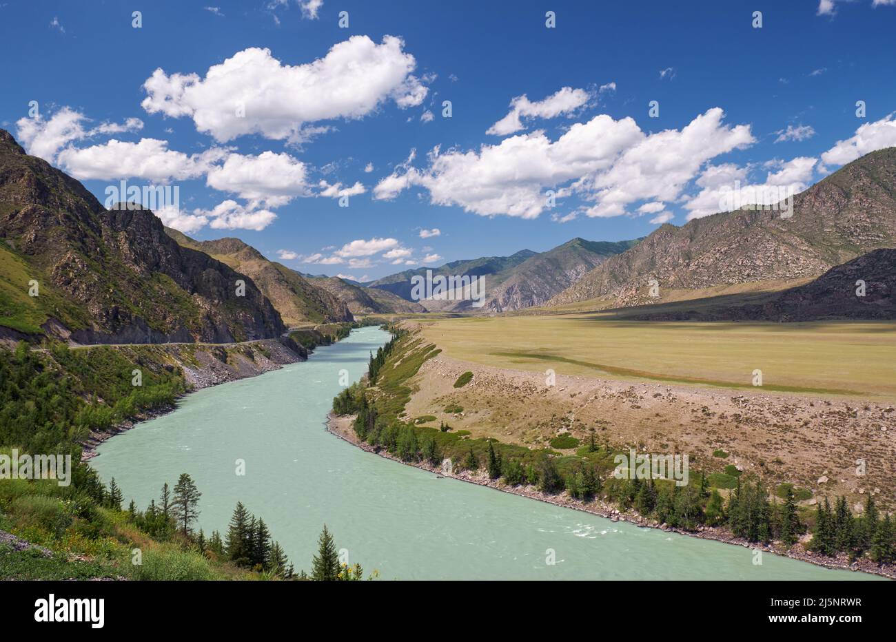 Altai natural landscape with river Katun under blue sky with clouds. On ...