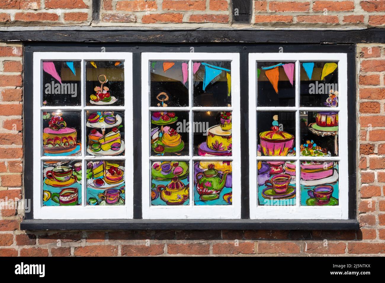 Painted window of Pinnock's coffee shop on Ripley High Street, Surrey ...