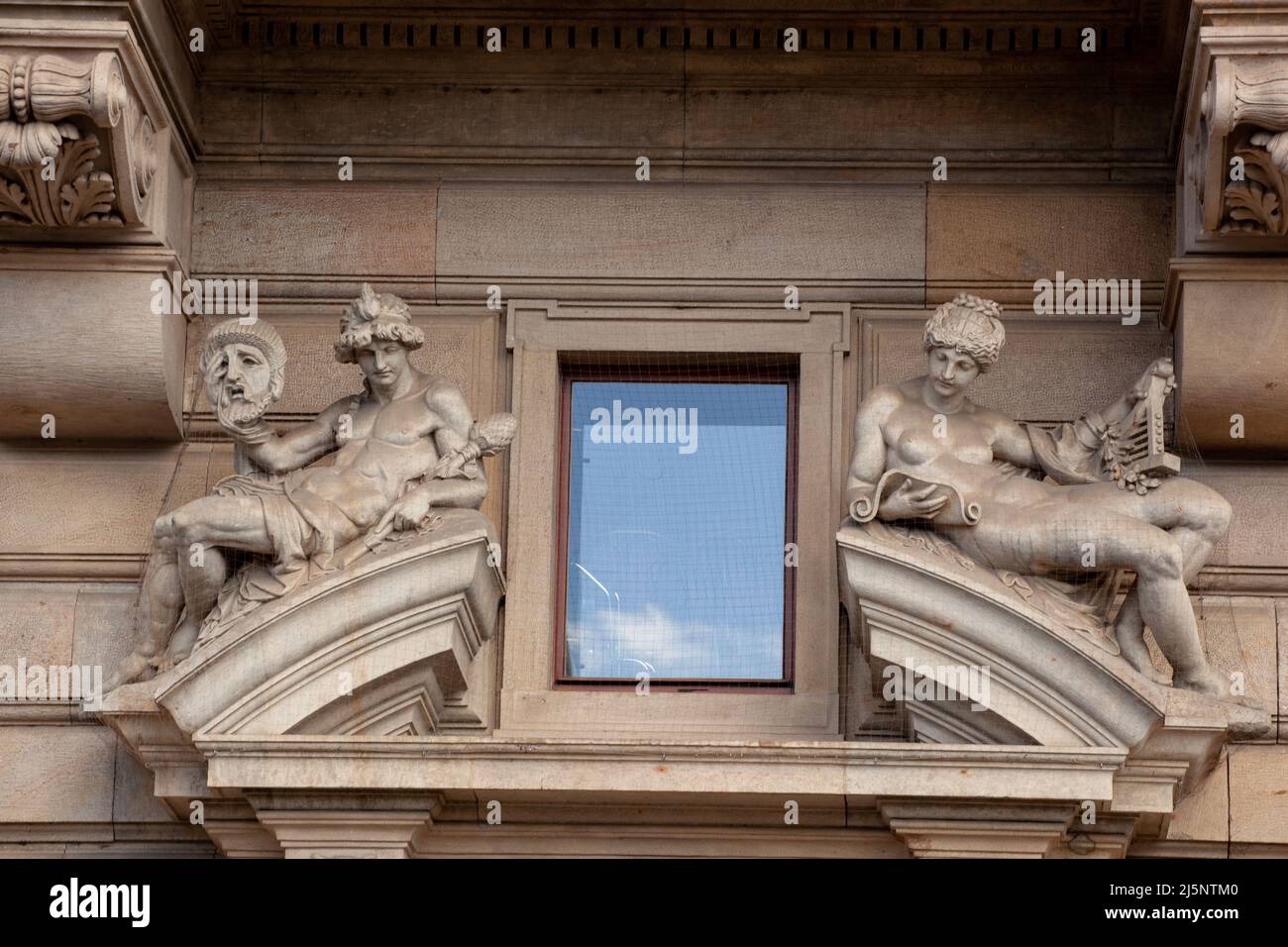 Two sculptures of women represent a goddess reading and another goddess ...