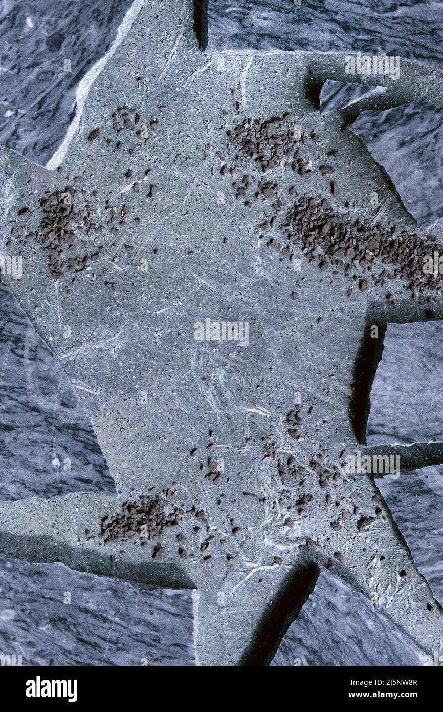 Layered flat stone background with broken pieces of granite plate and ...