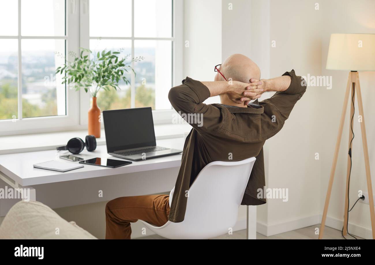 Back view man working on laptop hi-res stock photography and images - Alamy