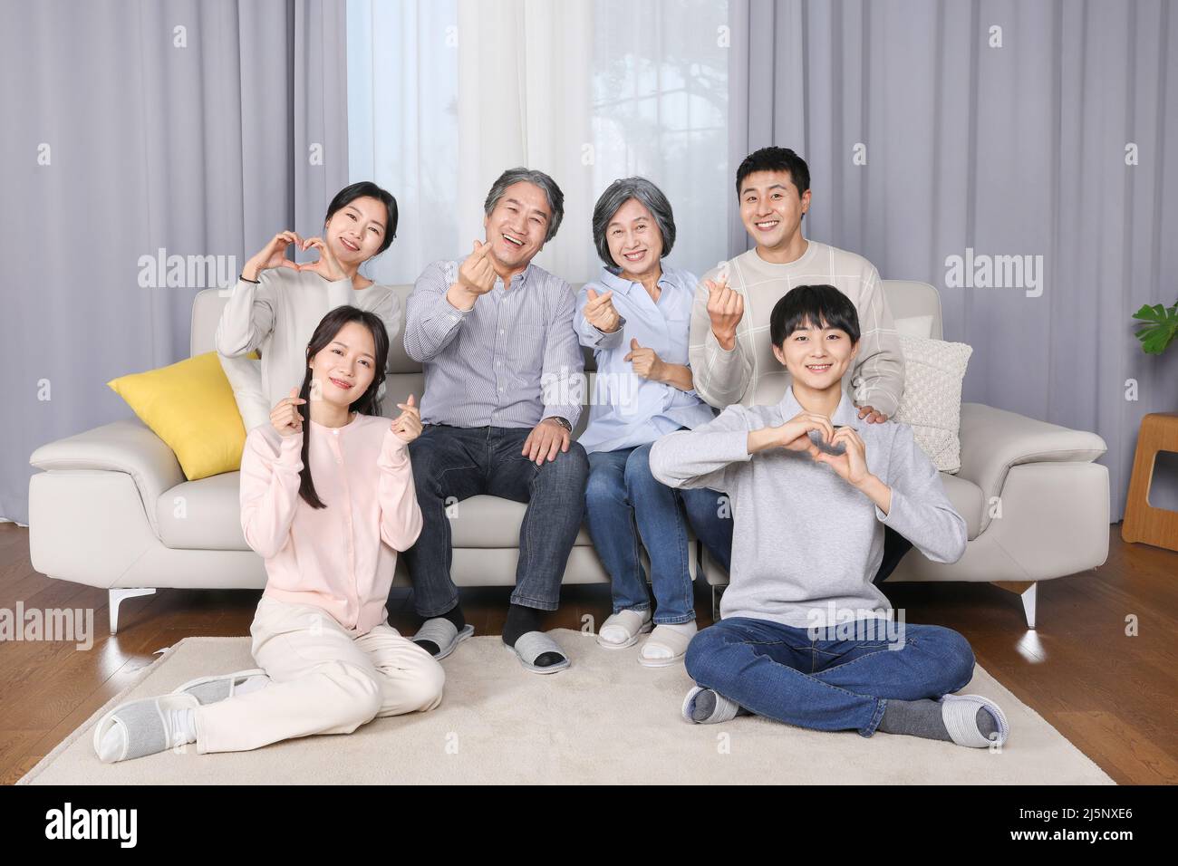 Asian Korean family Hand heart pose Stock Photo - Alamy