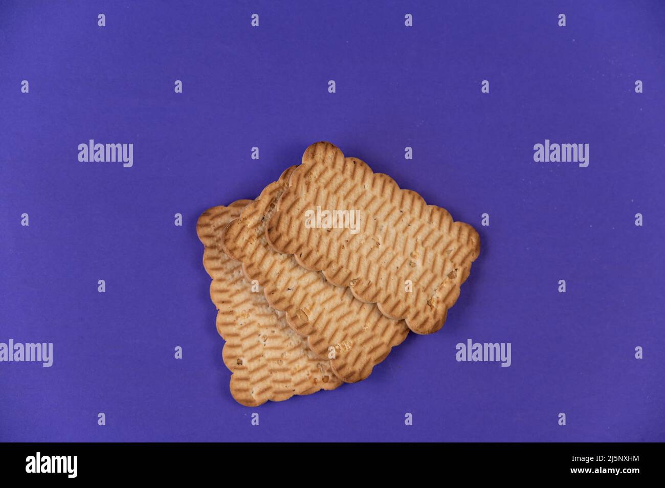 Three rectangular cookies against a blue background. Ready-to-eat ...
