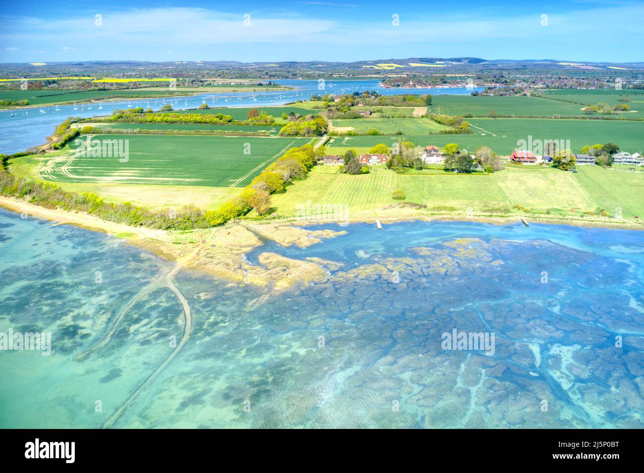 Aerial photo over estuary near Itchenor in Chichester Harbour towards ...