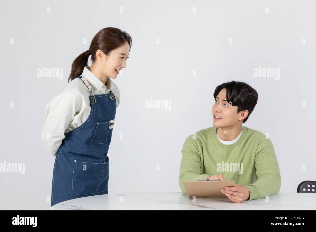 Asian Korean young man and woman startup concept customer and boss ...