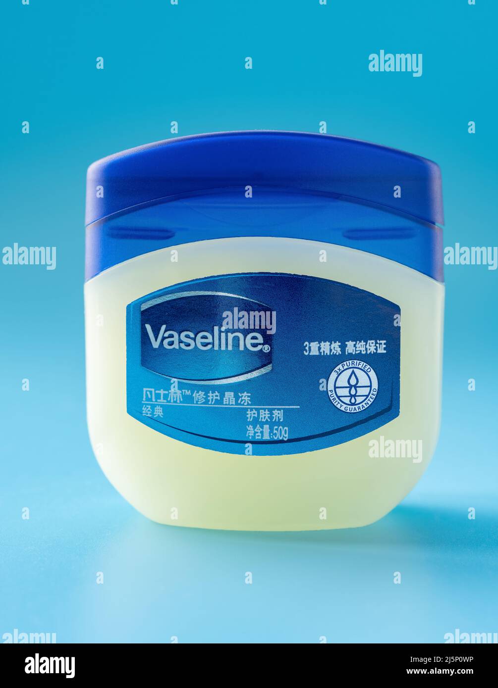 Zhongshan;China-March 1, 2020:bottle of vaseline on blue background ...