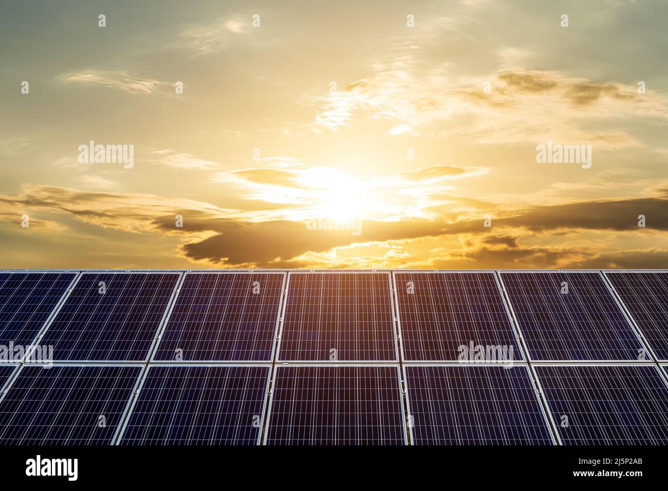 Solar panels and beautiful sunset clouds. green energy concept Stock ...