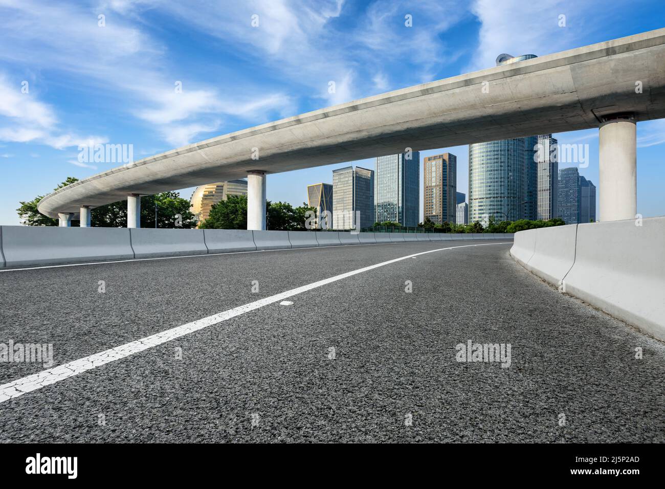 Asphalt road and city skyline with modern buildings in Hangzhou, China ...
