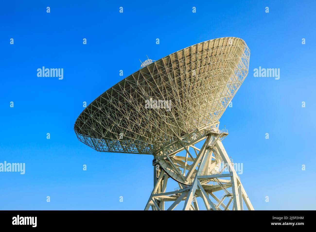 Astronomical radio telescope under blue sky. outer space exploration ...