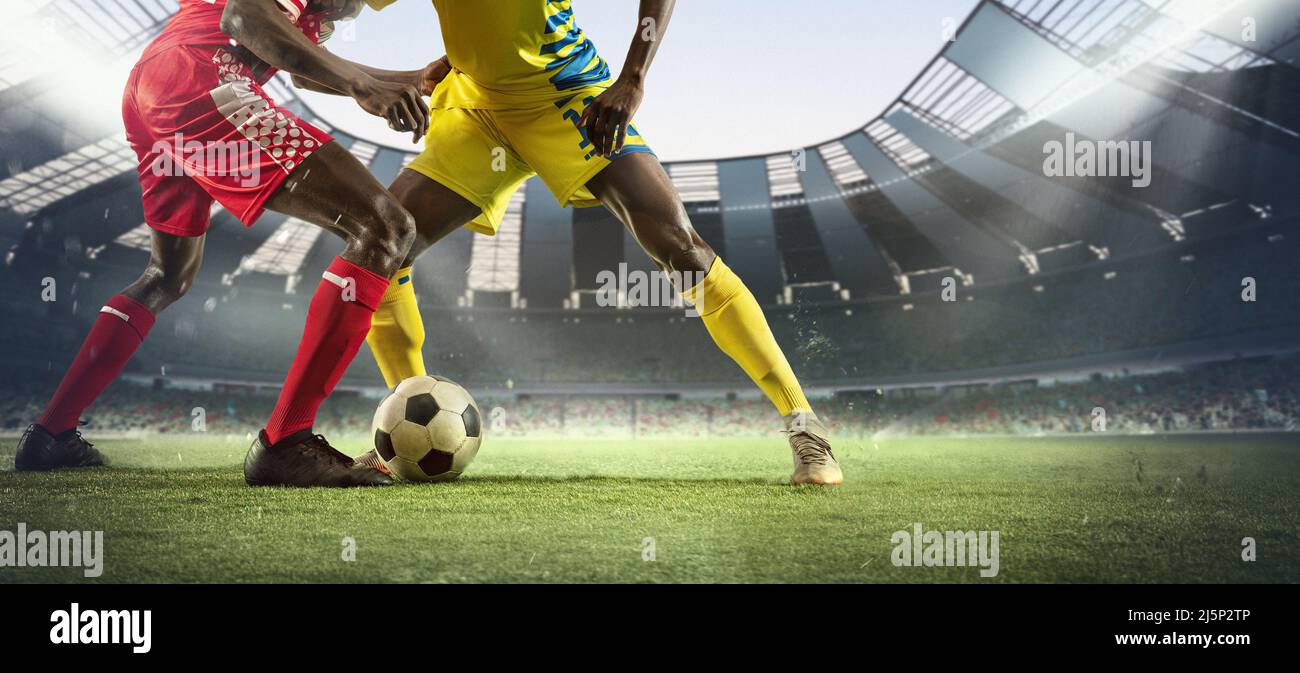 Cropped image of two soccer, football players in motion, action at ...