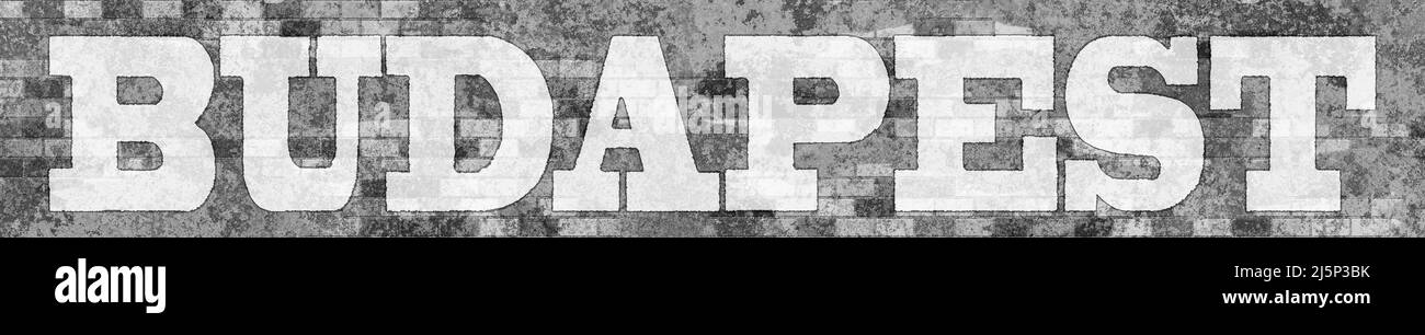 White lettering on a gray brick wall with the name of the city BUDAPEST ...