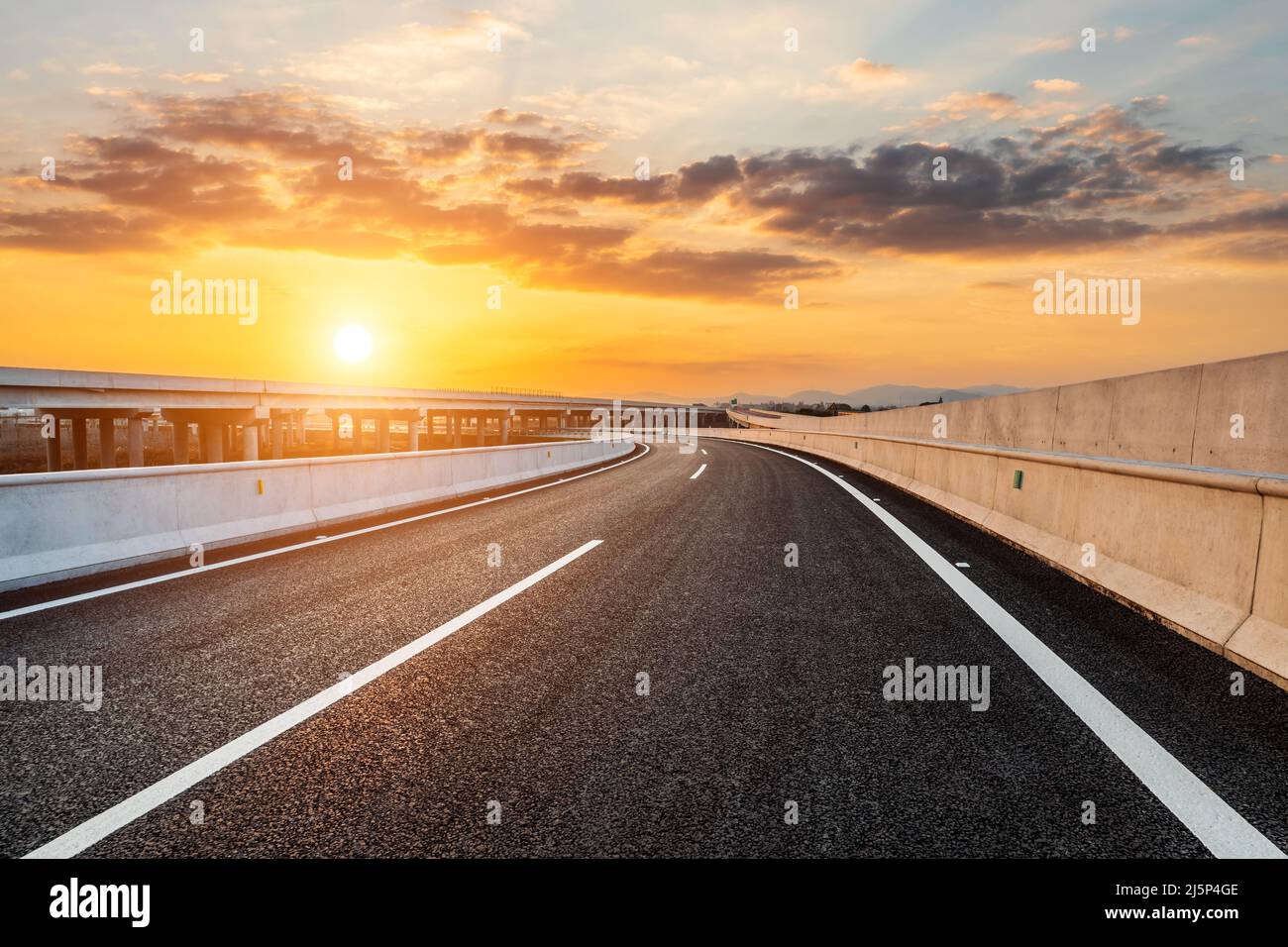 Asphalt highway and beautiful sky cloud landscape at sunset. Road and ...