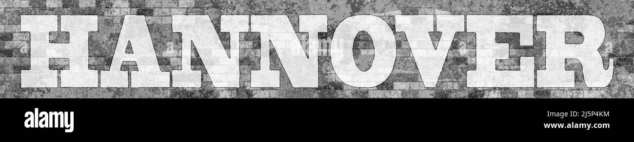 White lettering on a gray brick wall with the name of the city HANNOVER ...