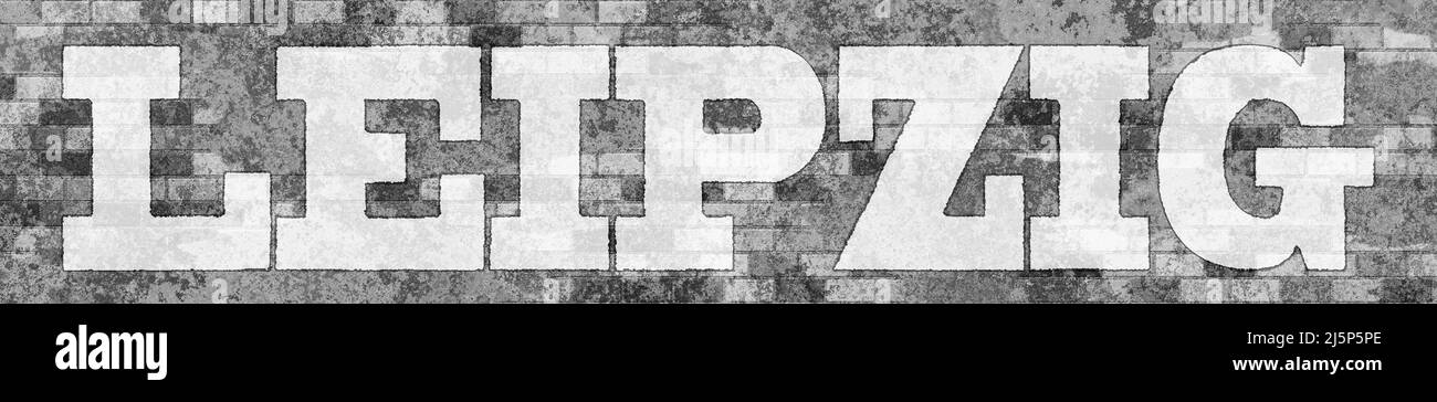 White lettering on a gray brick wall with the name of the city LEIPZIG ...
