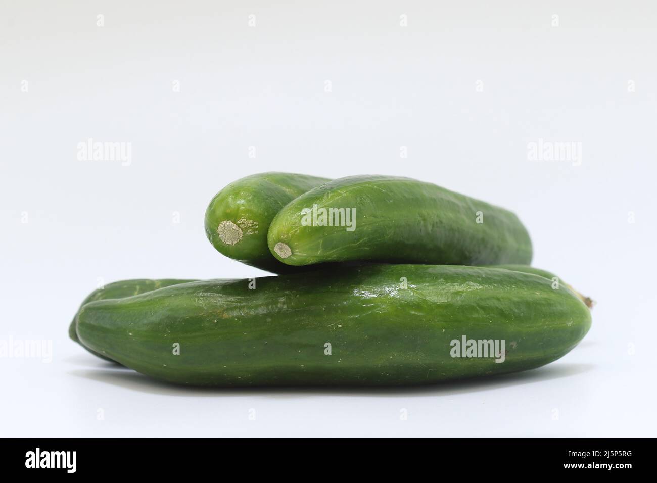cucumbers on white background Stock Photo - Alamy
