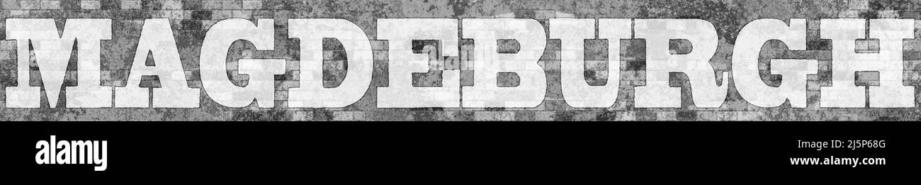 White lettering on a gray brick wall with the name of the city ...