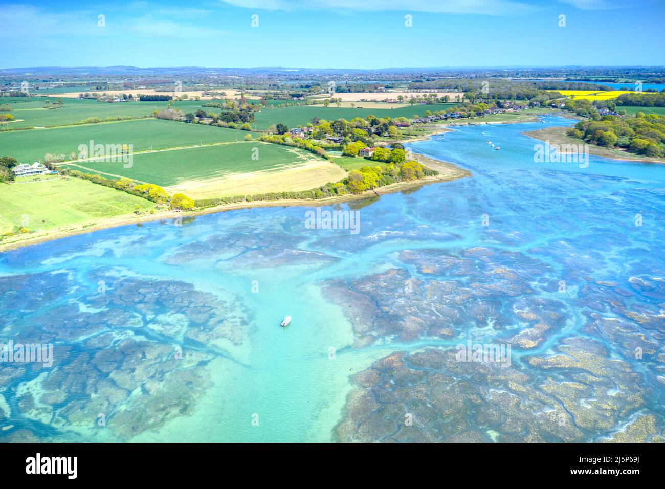 Aerial photo over the estuary that leads into the small hamlet of ...