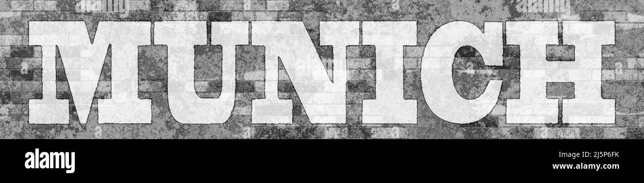 White lettering on a gray brick wall with the name of the city MUNICH ...