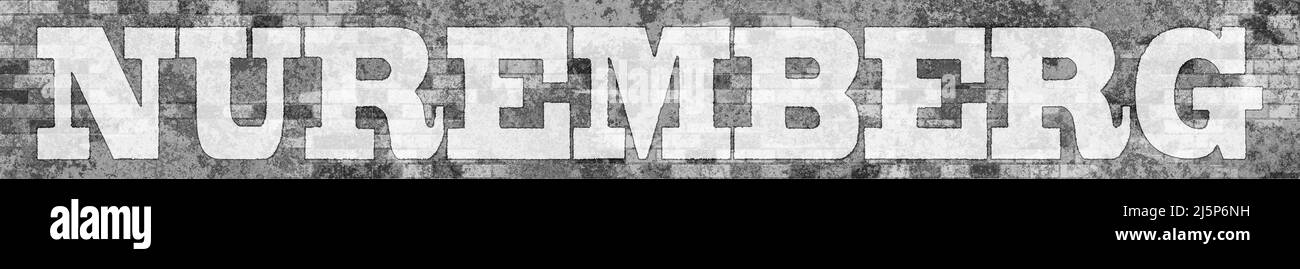 White lettering on a gray brick wall with the name of the city ...